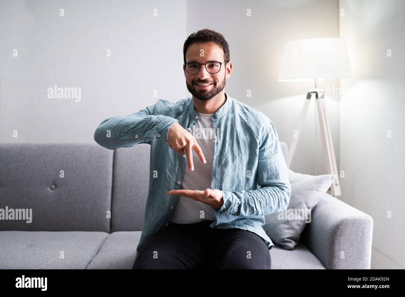 Adult Learning Sign Language For Deaf Disabled Stock Photo - Alamy