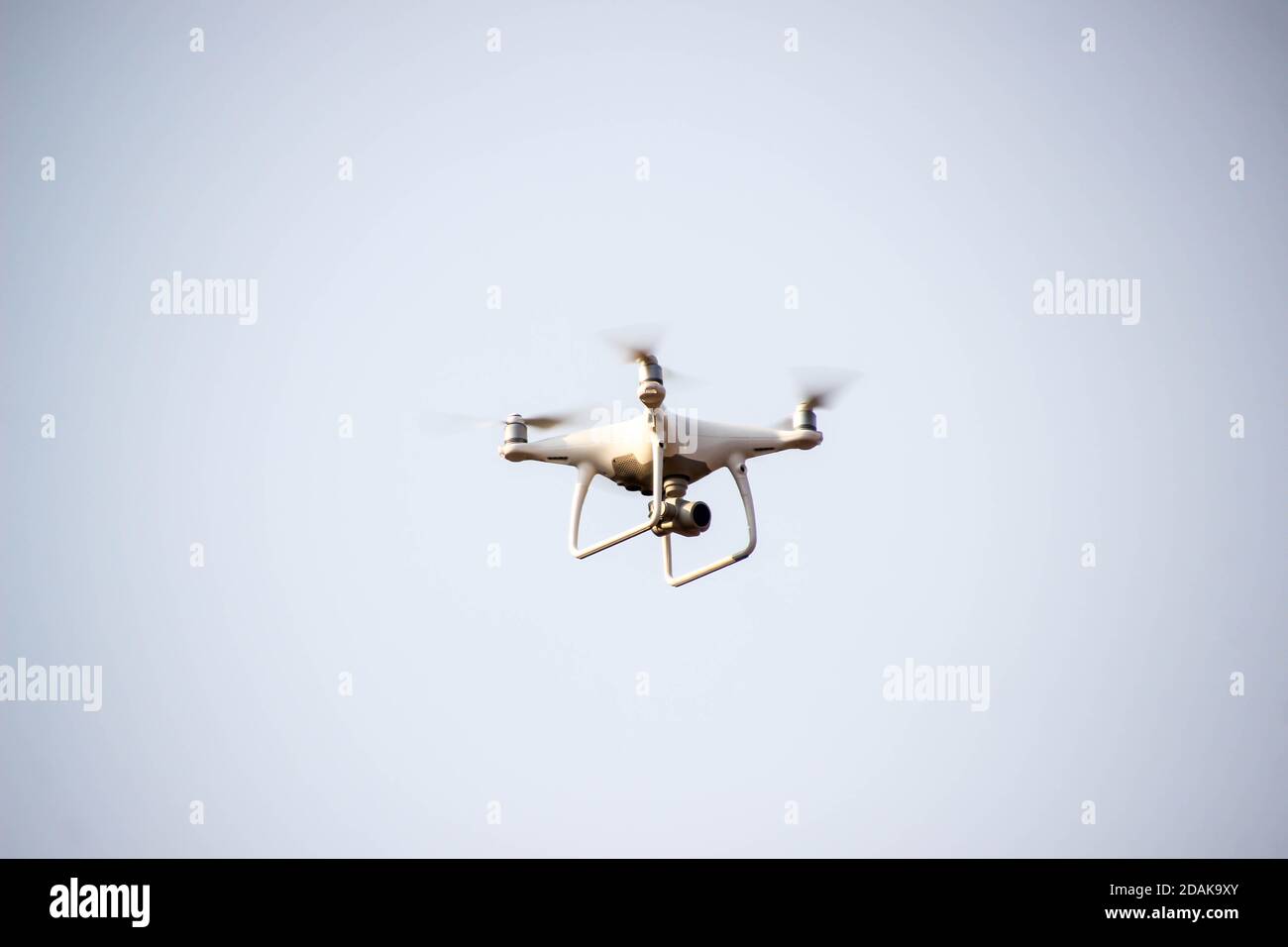 Drone flying around the area Stock Photo - Alamy