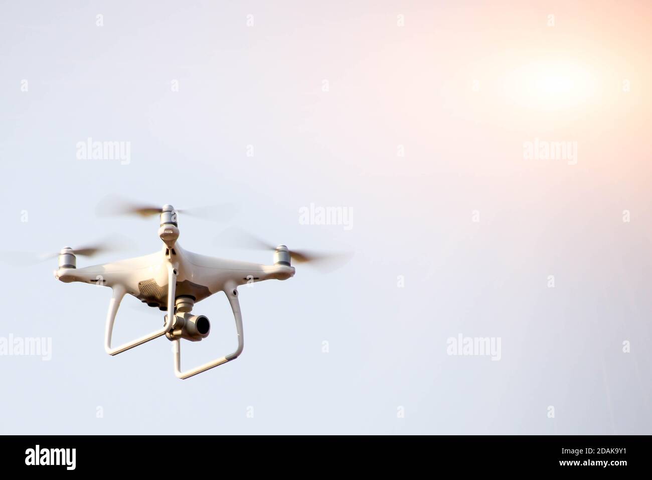 Drone flying around the area Stock Photo - Alamy