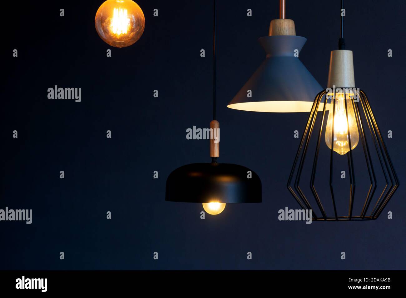 Interior decoration of stylish housing. Loft style incandescent lamp ...