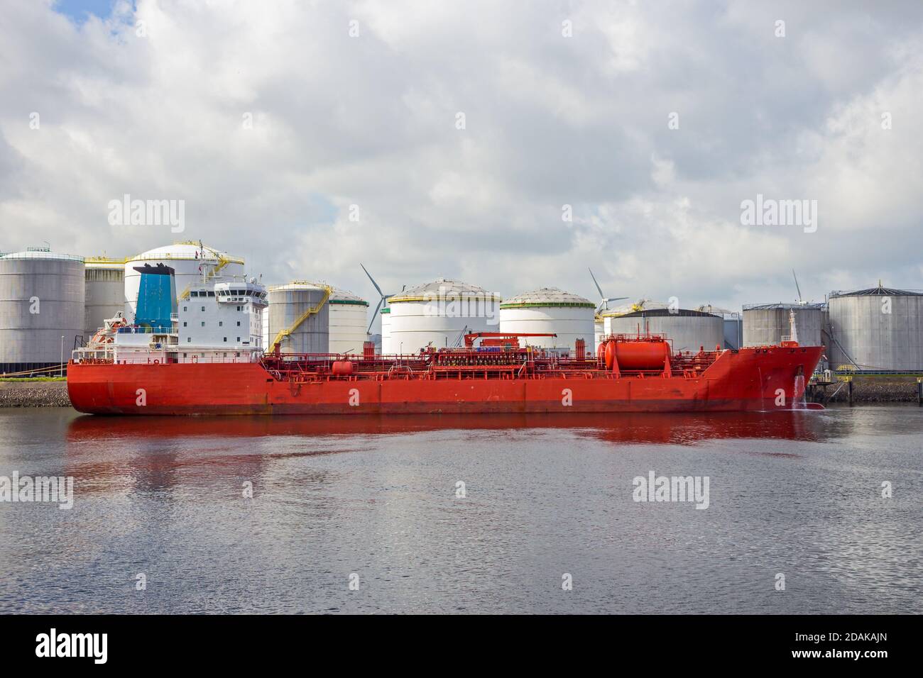 Red oil tanker moored at an silo's at an oil terminal in the Port of ...