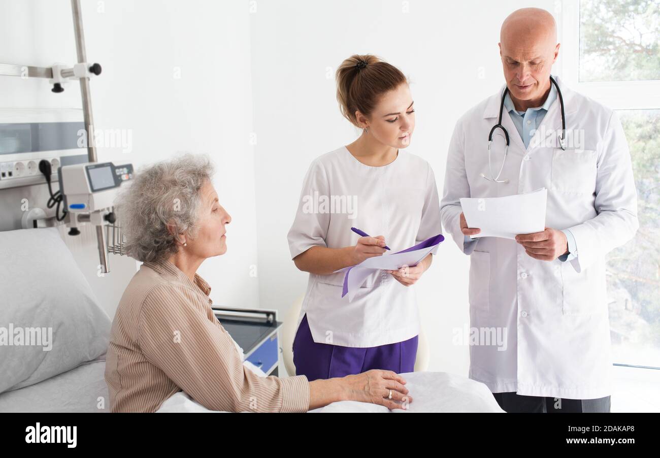 medical Caring about senior people. elderly patient lying in a hospital ...