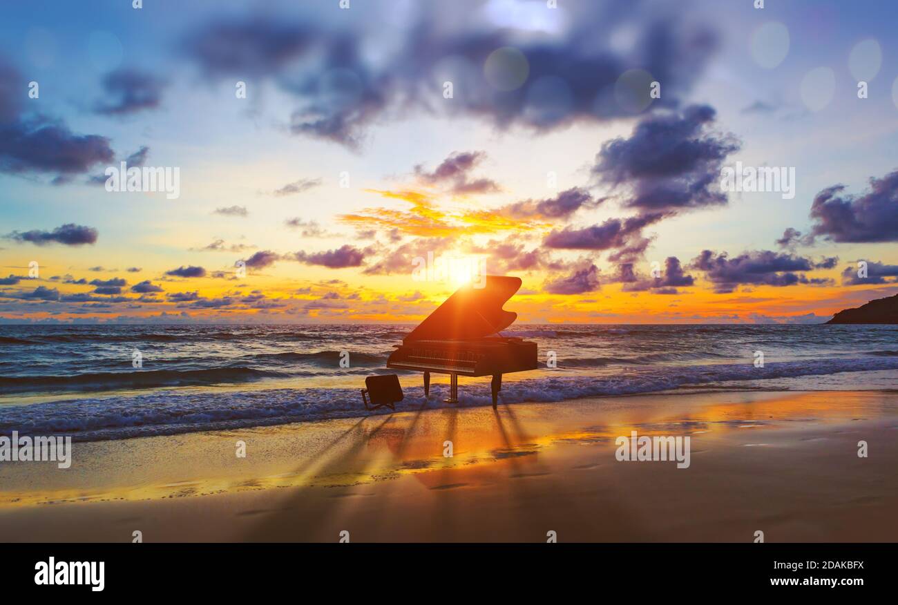 Surreal image of grand piano in scenic sunset beach. Music background ...