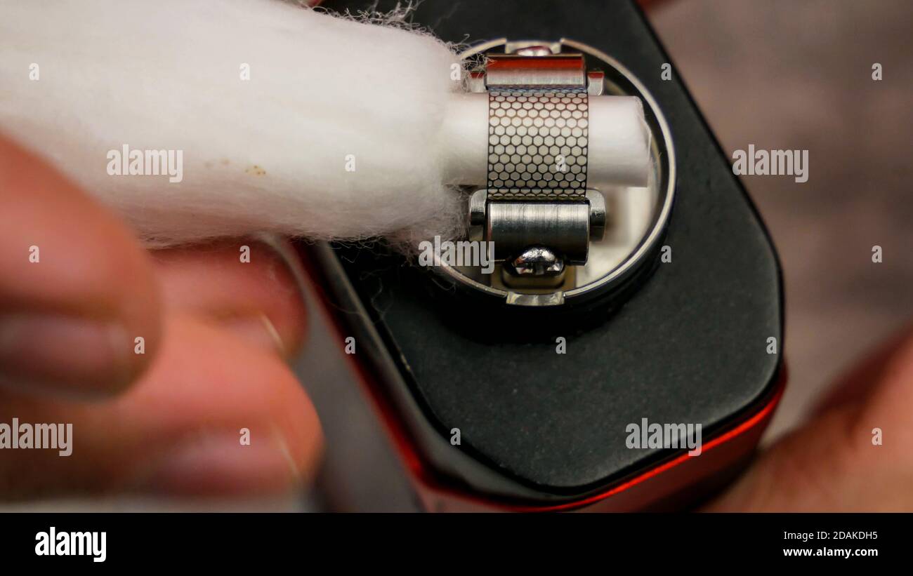 Preparation of mesh coil in the atomizer for vaping - Inserting the ...