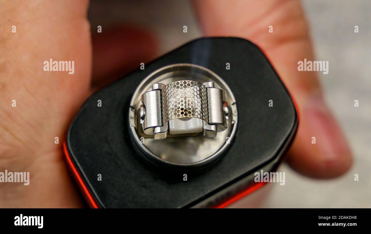 Preparation of mesh coil in the atomizer for vaping. The first heating ...