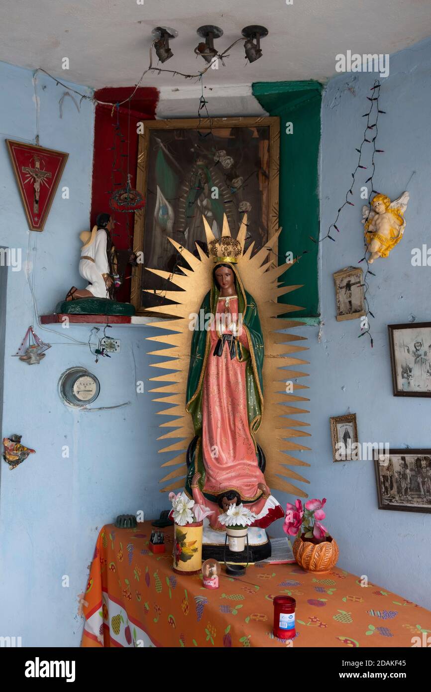 Small religious shrine in a store Stock Photo - Alamy