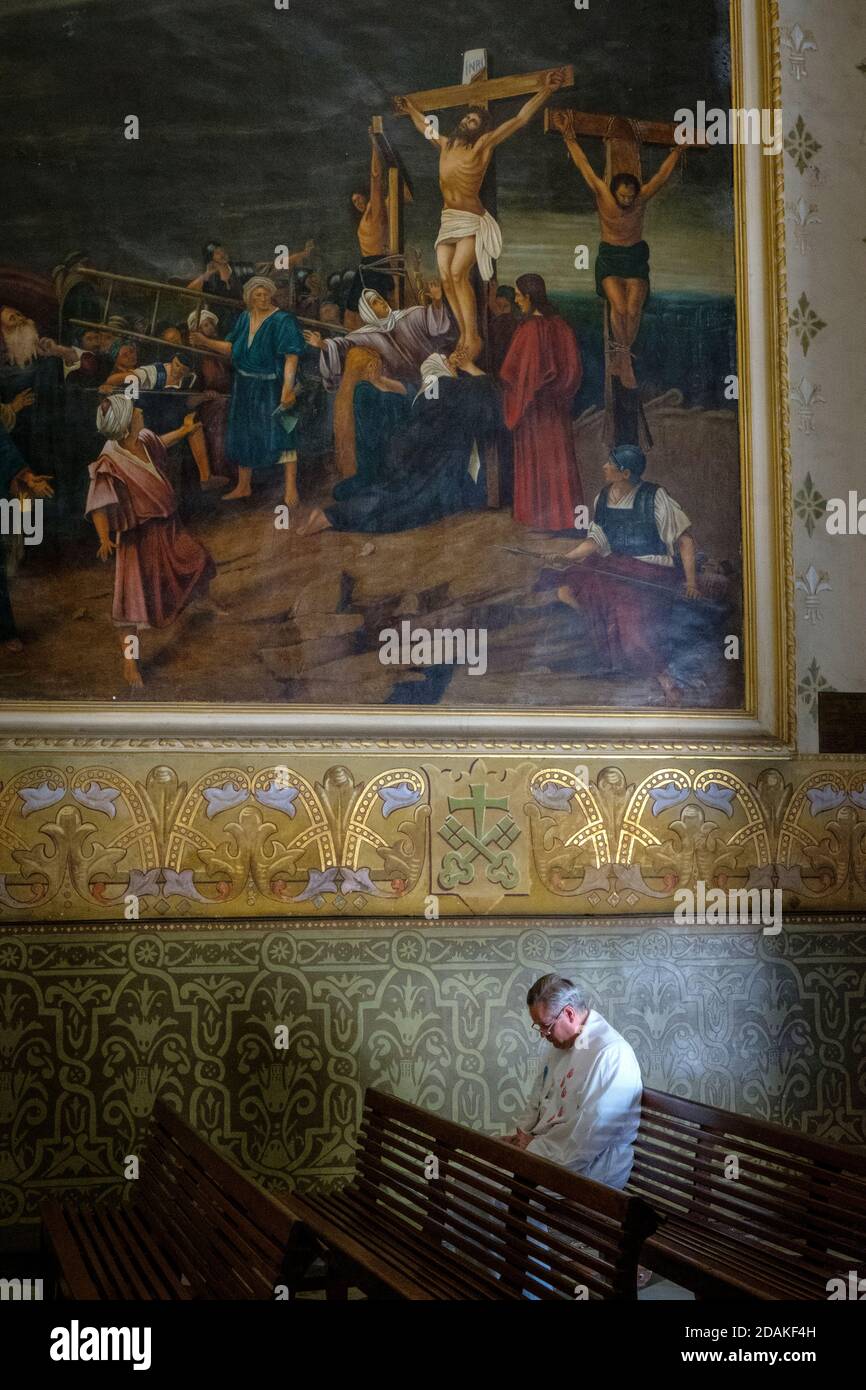 Priest at Church Praying Stock Photo - Alamy