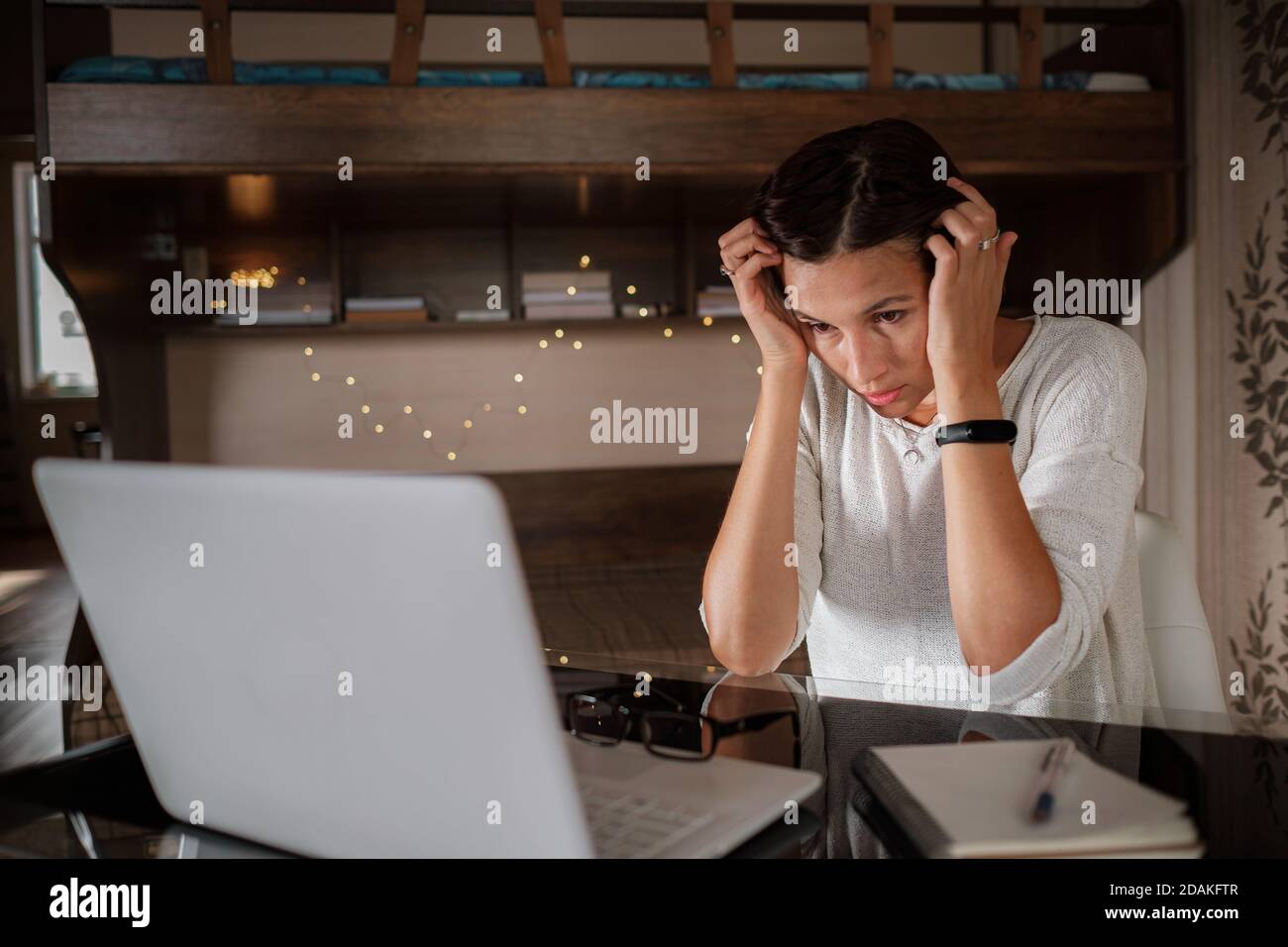 Thoughtful doubtful asian female student worker looking away thinking ...