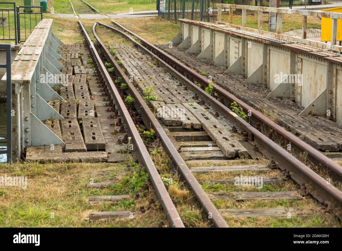 detail of old railroad tracks covered with rust on a bridge Stock Photo ...