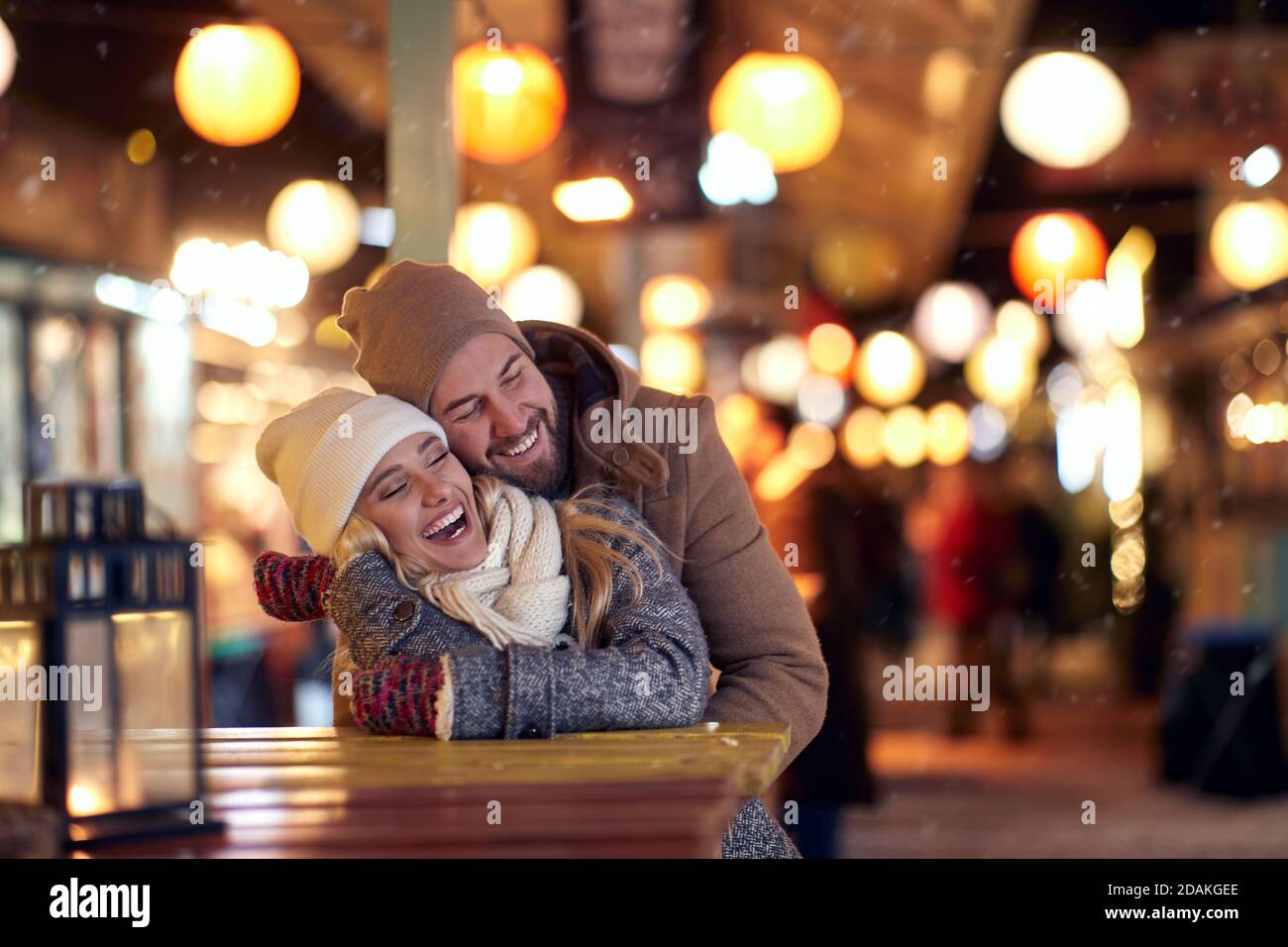 A young cheerful couple having a good time in a walk of the city on a ...
