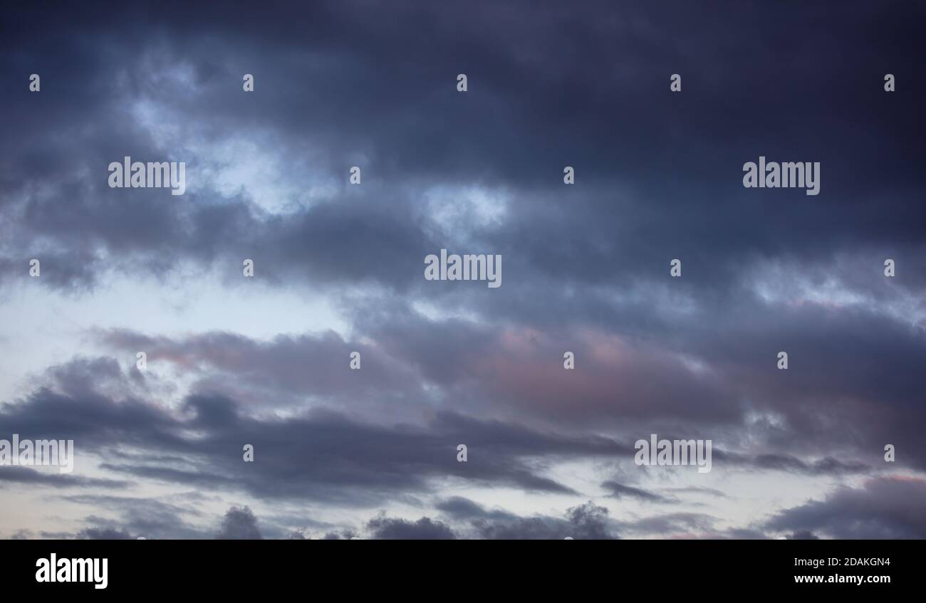 Sunset clouds. Dramatic magical sunrise cloudscape over blue gray color ...