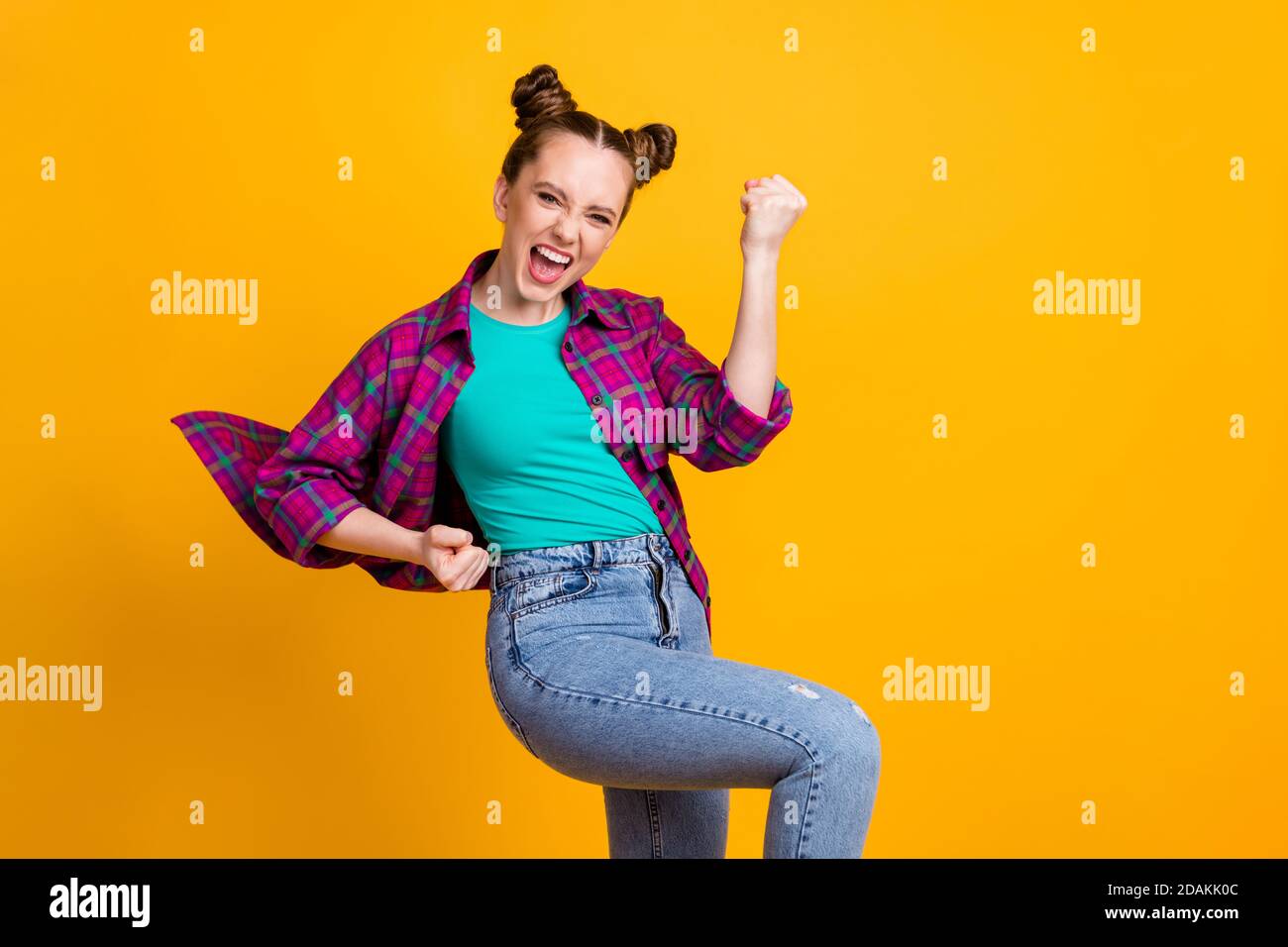 Photo of attractive excited crazy teen lady two funny buns good mood ...