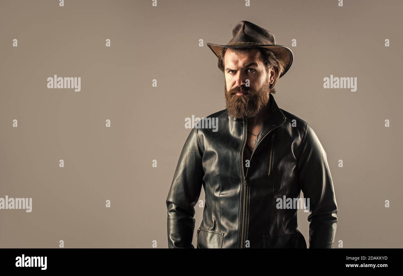mens western wardrobe. fashionable man dressed in leather jacket. west ...