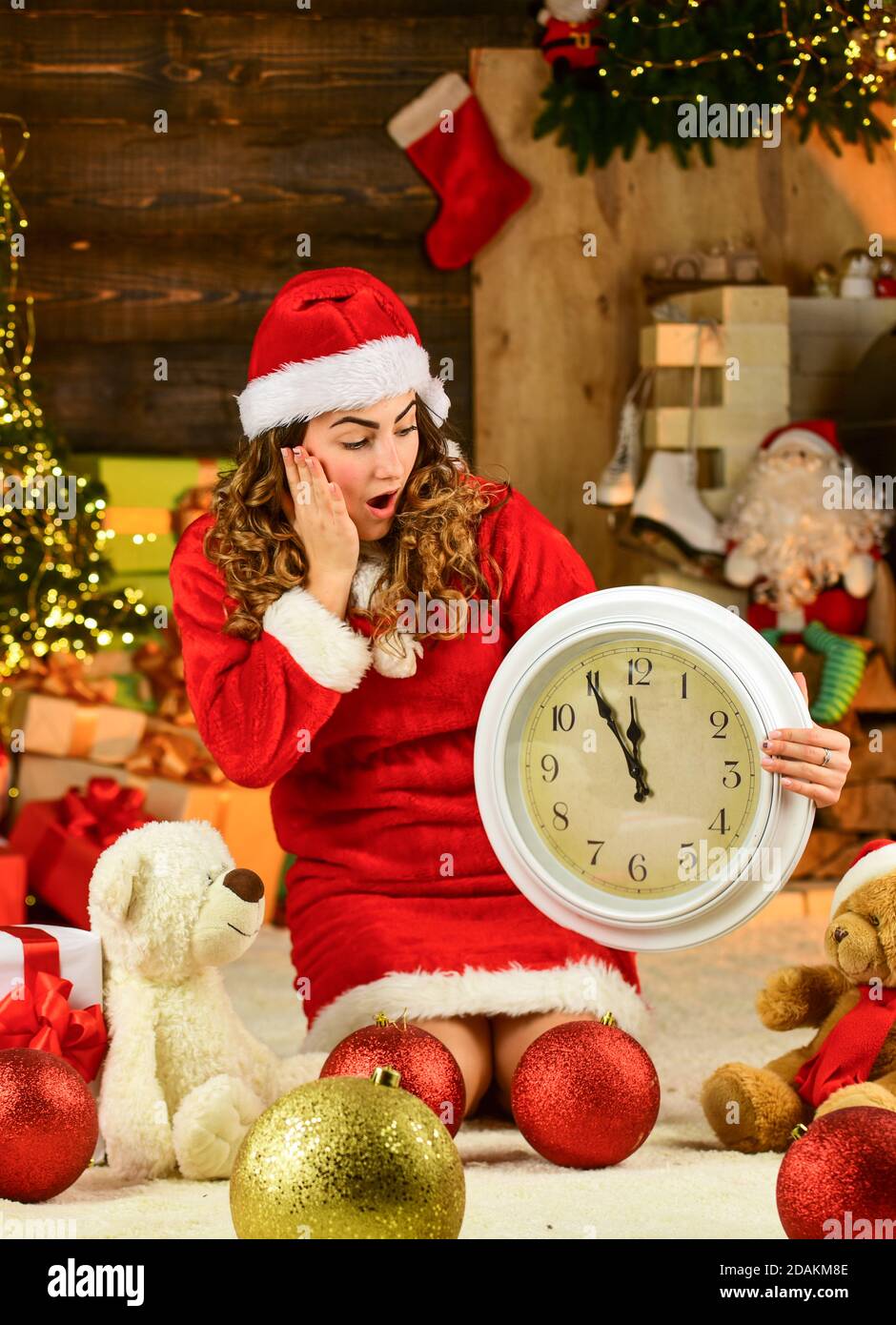 Tis the season to be Jolly. almost midnight. santa girl hold clock ...