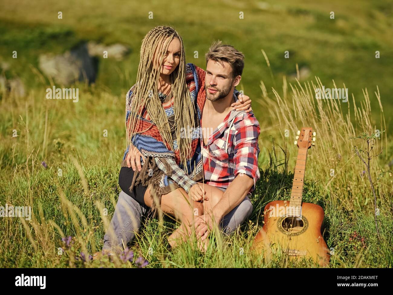 Romantic hike. Family hike. Boyfriend and girlfriend with guitar in ...