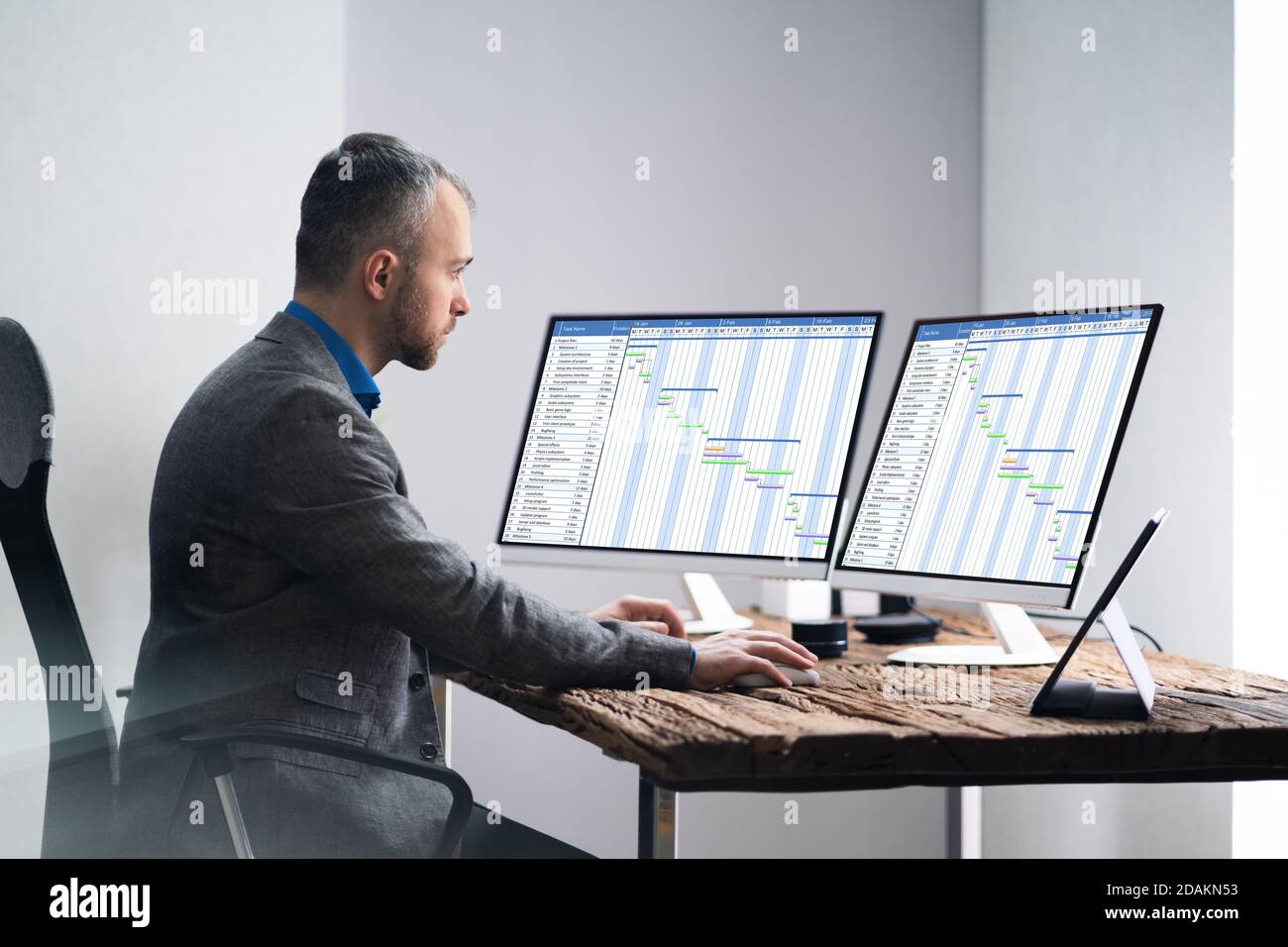 Gantt List Or Chart On Computer In Office Stock Photo - Alamy