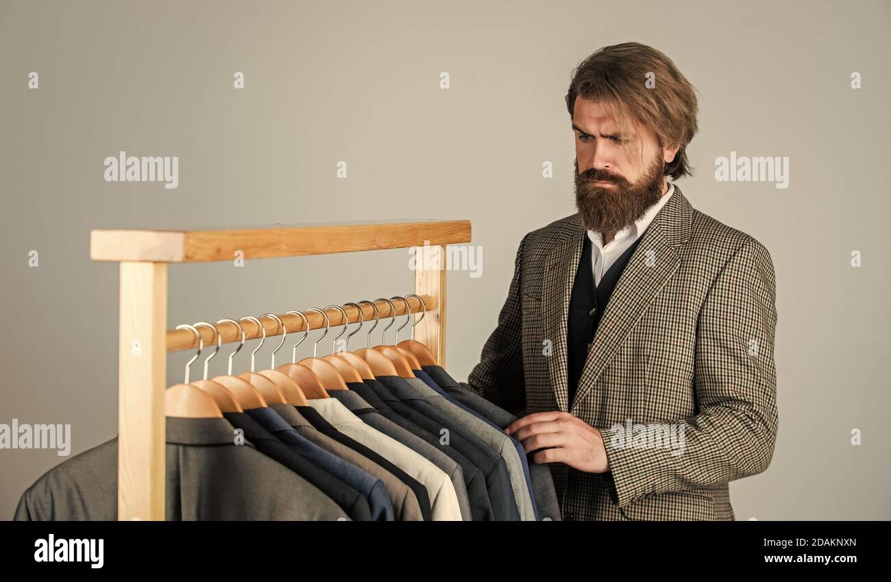 In search of inspiration. bearded man tailoring clothes. formal and ...