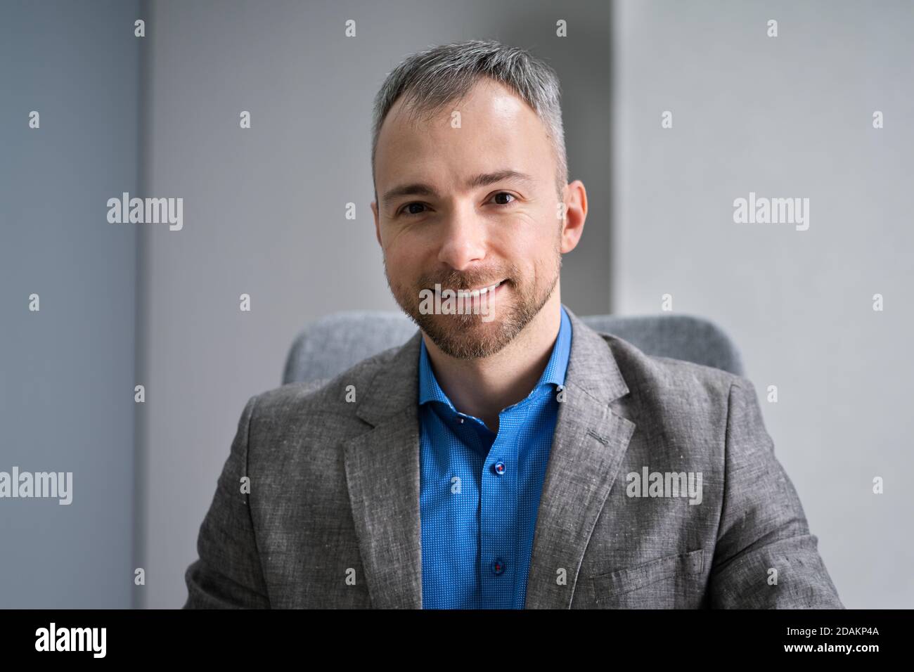 Portrait Of Smiling Man In Office Video Conference Stock Photo - Alamy