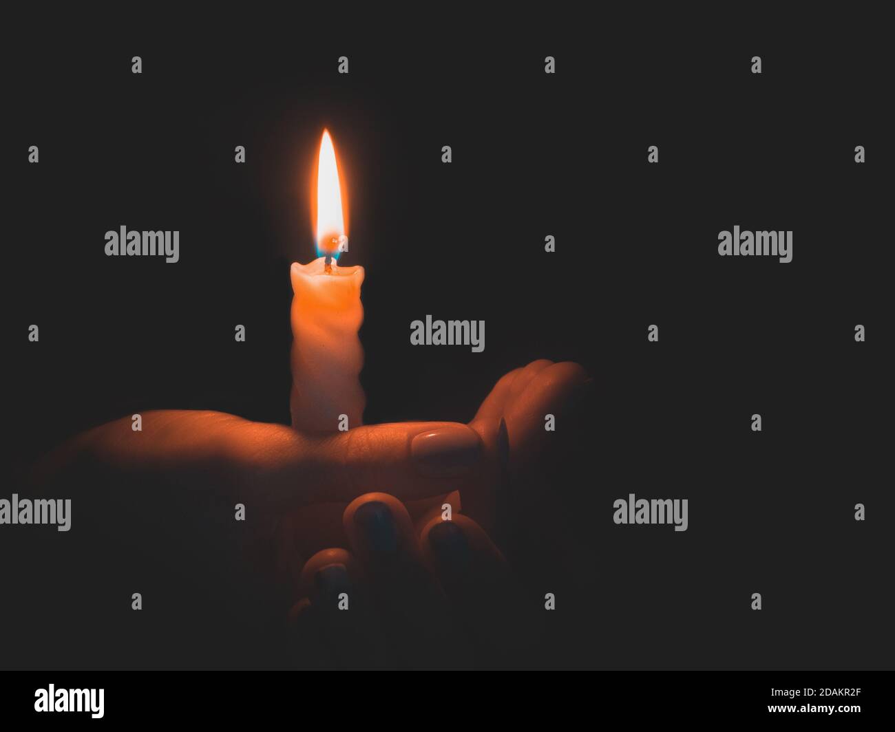 Yellow candle in hand hi-res stock photography and images - Alamy