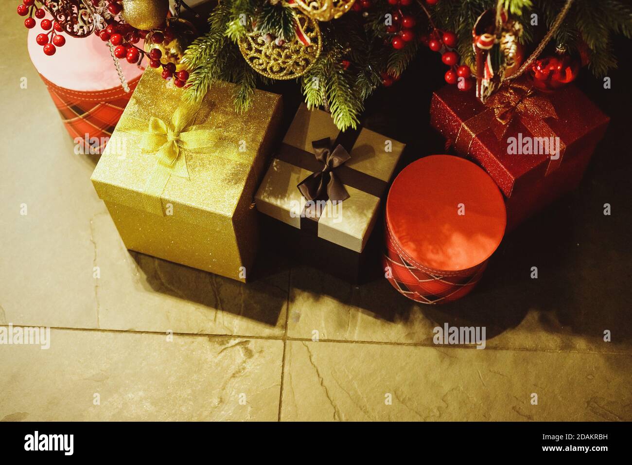 Gift boxes under christmas tree.Many Christmas gifts on floor under fir ...