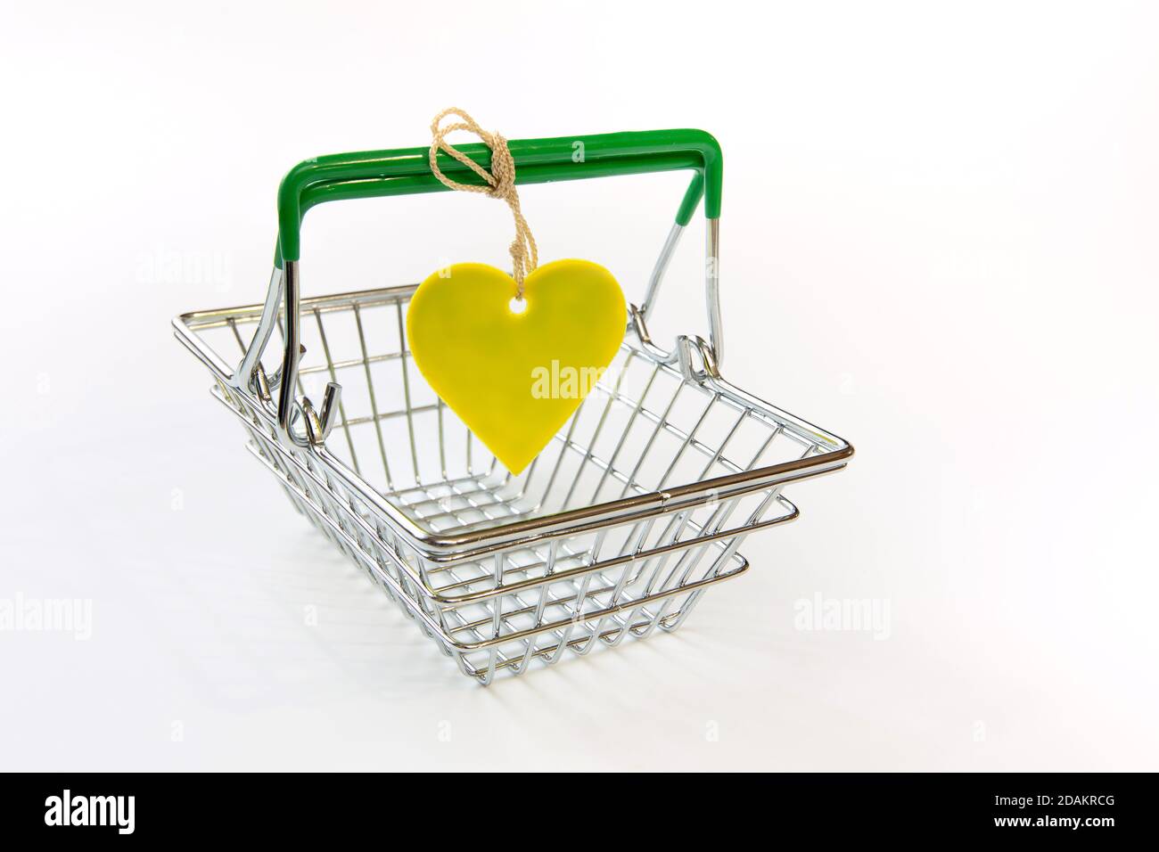 Shopping basket and heart label on white background. Sale and discount ...