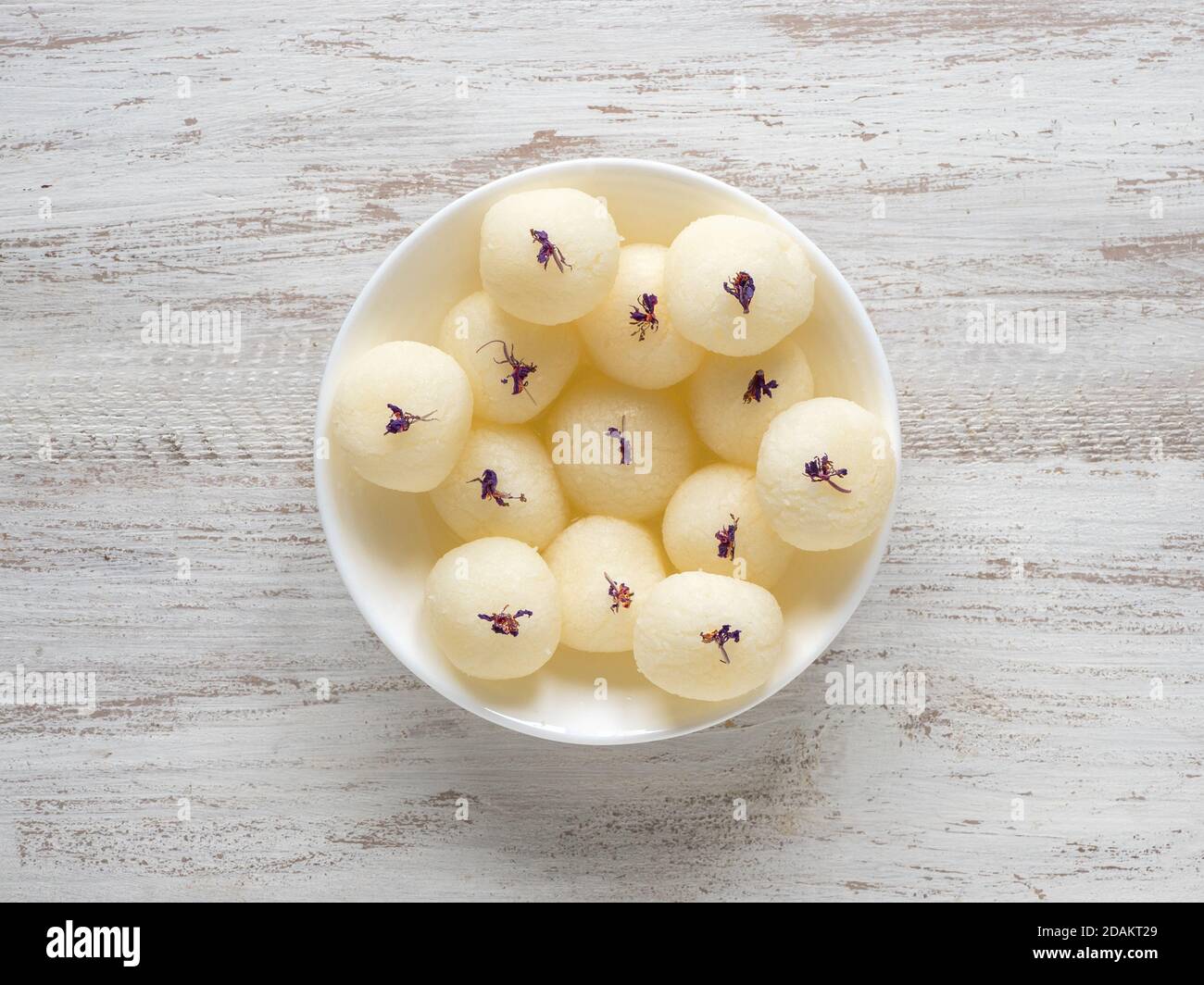 Indian Rasgulla dessert. Sweet served in a bowl, top view Stock Photo ...