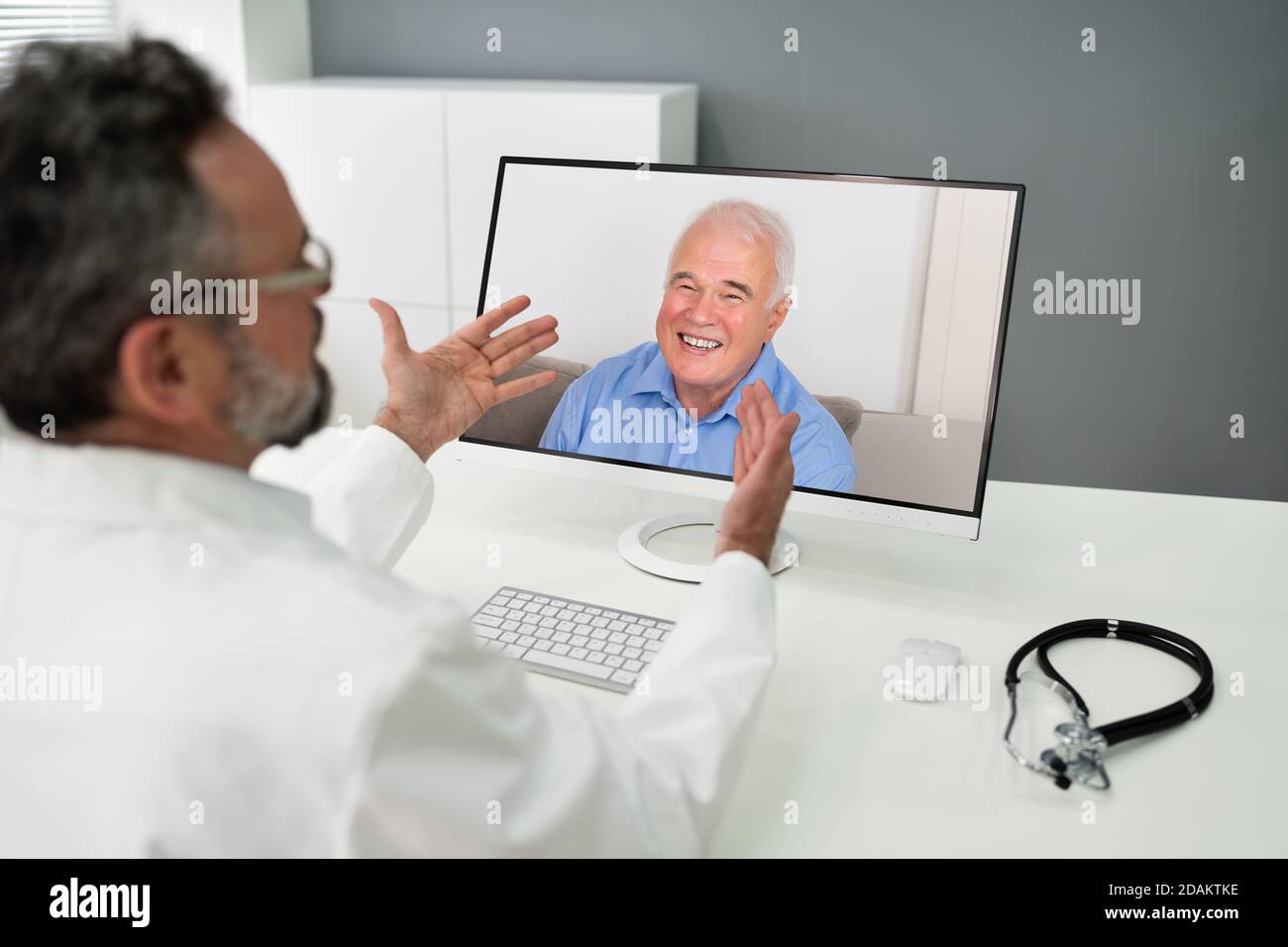 Doctor Talking With Patient Online In Video Call On Computer Stock ...