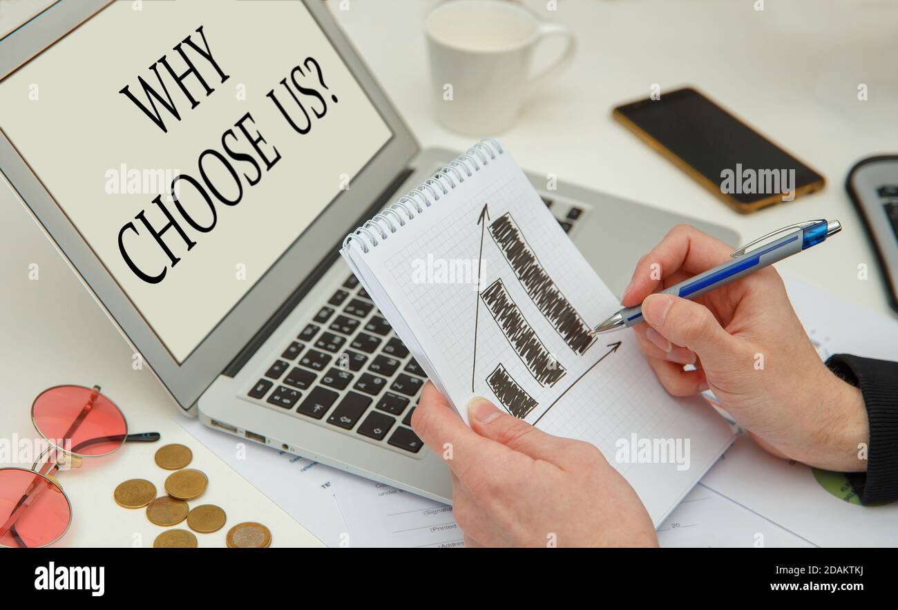 Why Choose Us - an inscription on the computer. The concept photo shows ...