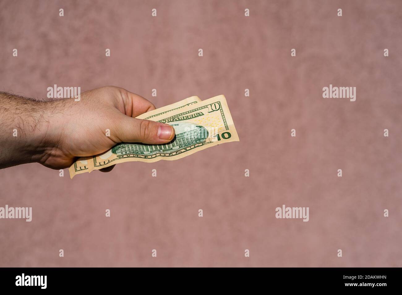 Hand holding showing dollars money and giving or receiving money like ...