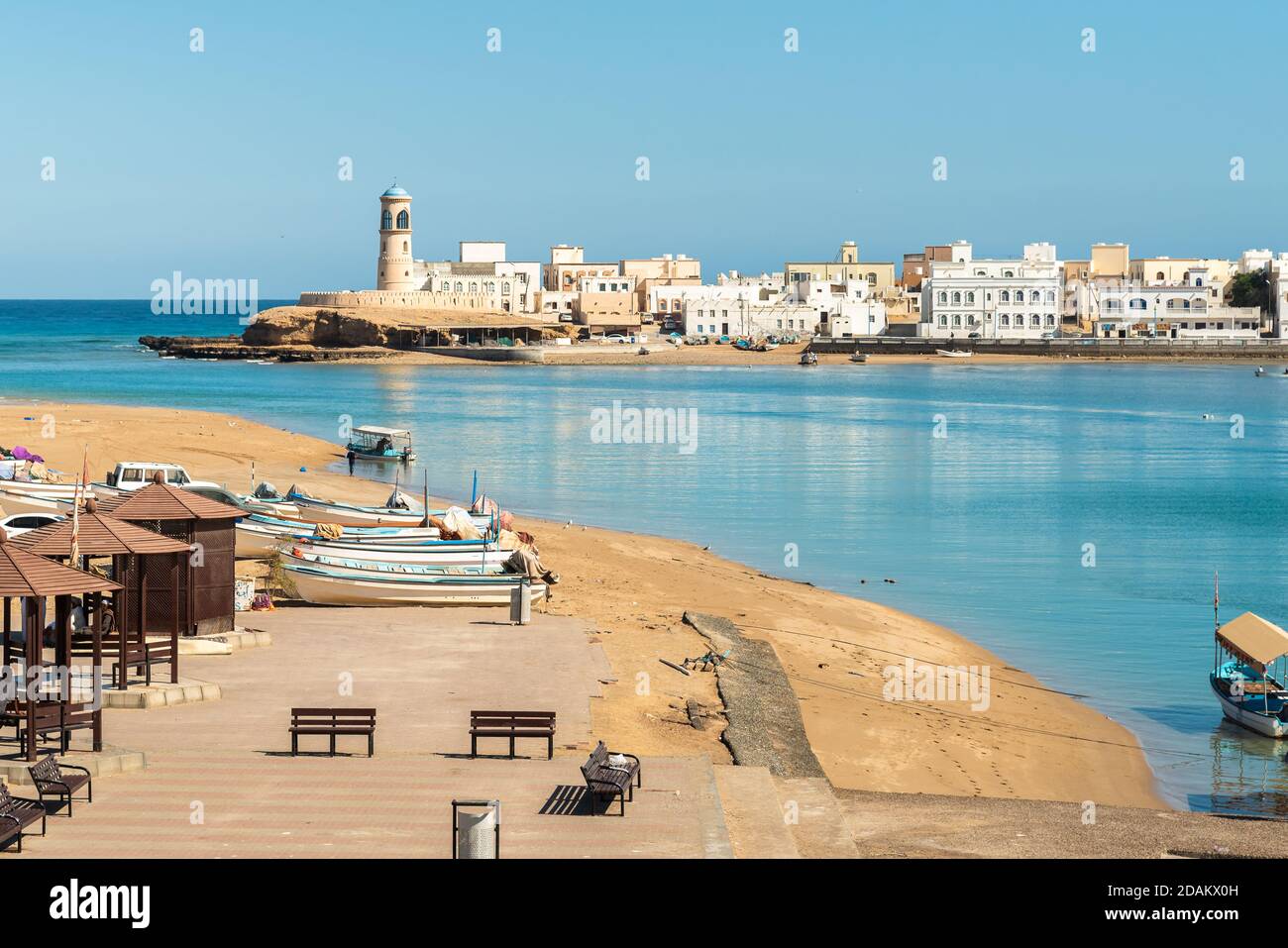 Landscape of Sur with Al Ayjah Lighthouse and fish boats on the beach ...