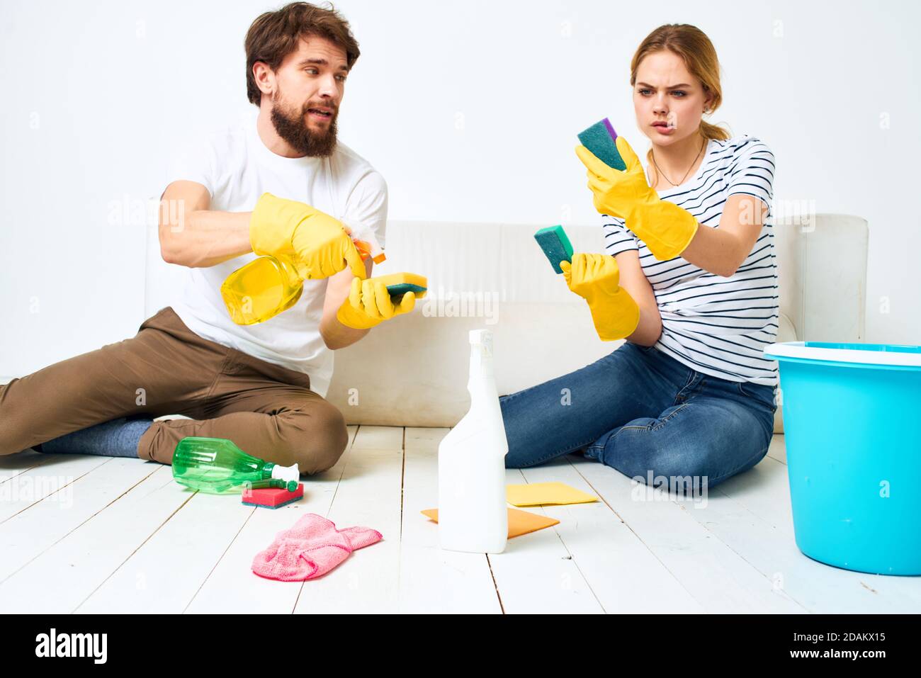 Young couple detergent washing the floor working together lifestyle ...