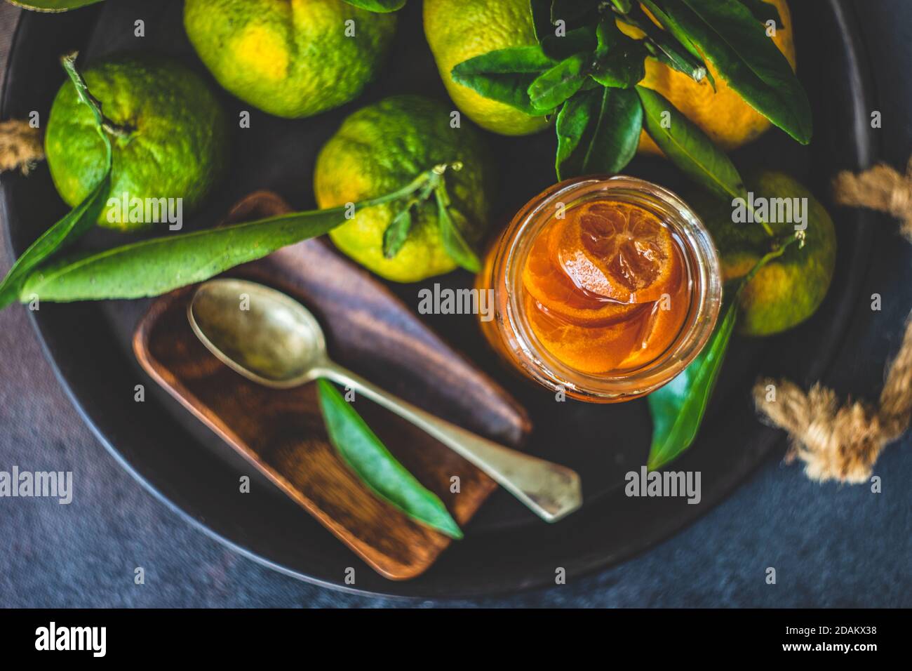 Freshmade tangerine fruit preserve on rustic background with copy space ...