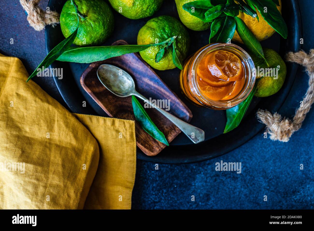 Freshmade tangerine fruit preserve on rustic background with copy space ...