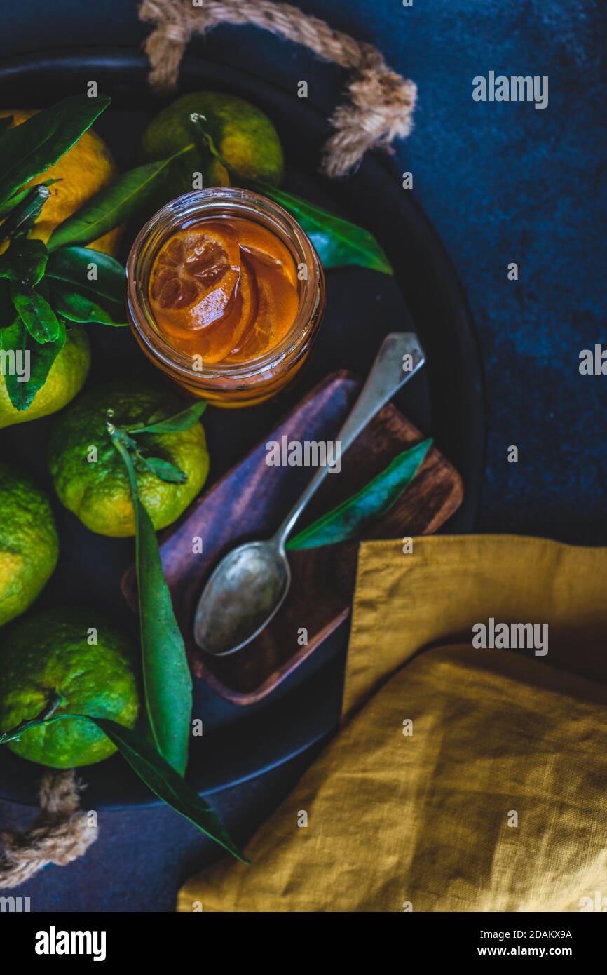 Freshmade tangerine fruit preserve on rustic background with copy space ...