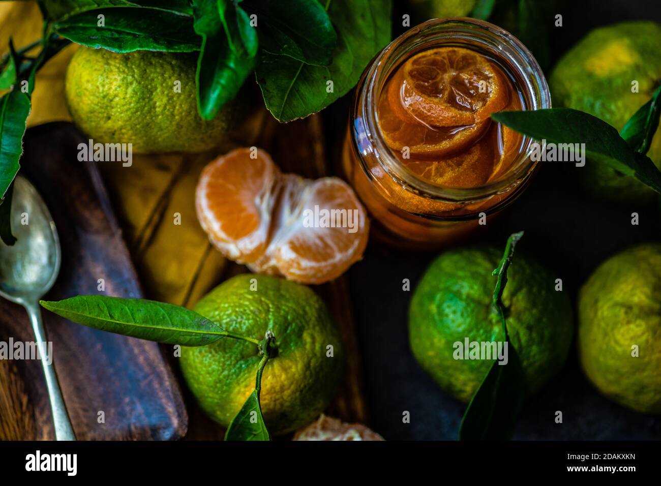 Freshmade tangerine fruit preserve on rustic background with copy space ...