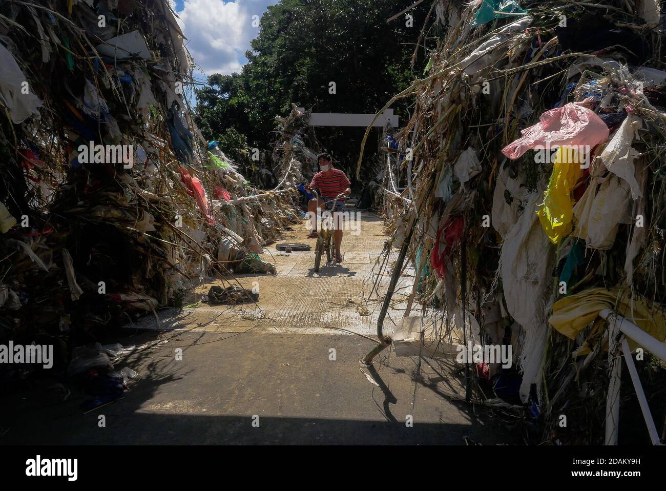 Marikina, Philippines. 13th Nov, 2020. Man cycles on this bridge ...