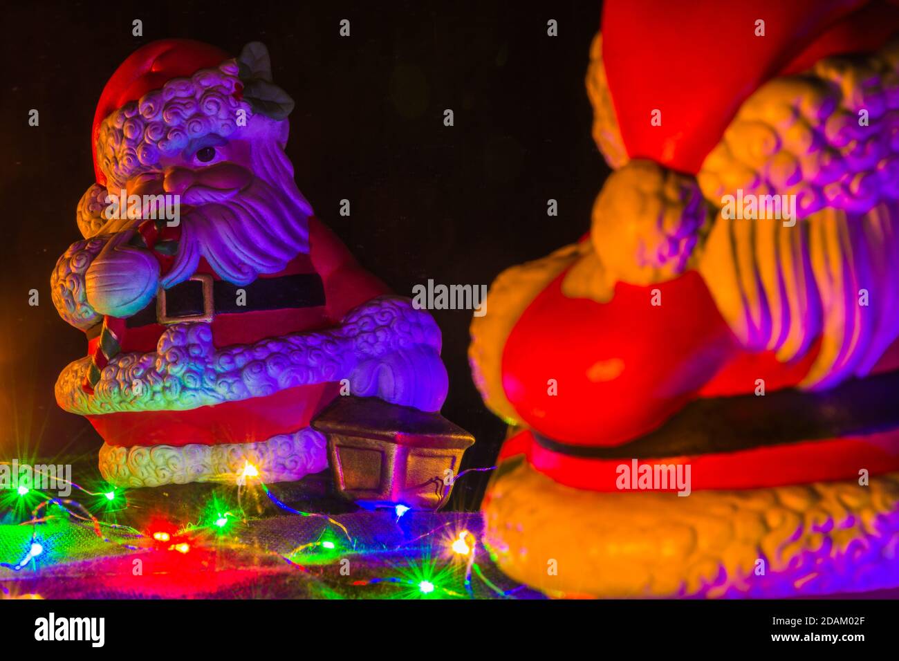 Santa Claus figure from front and back with lights around Stock Photo ...