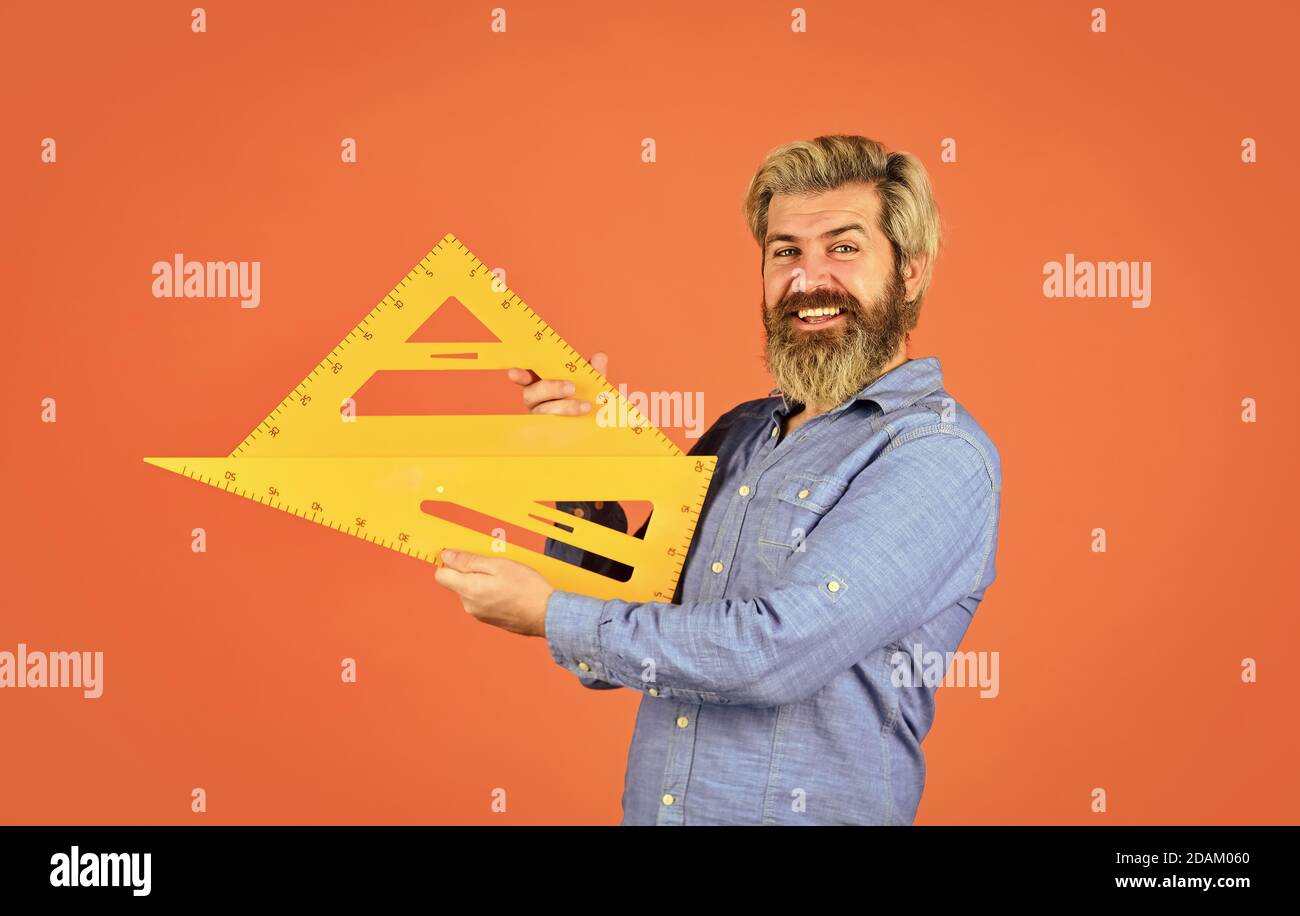 Auxiliary equipment. Architect education. Bearded man teacher use ruler ...