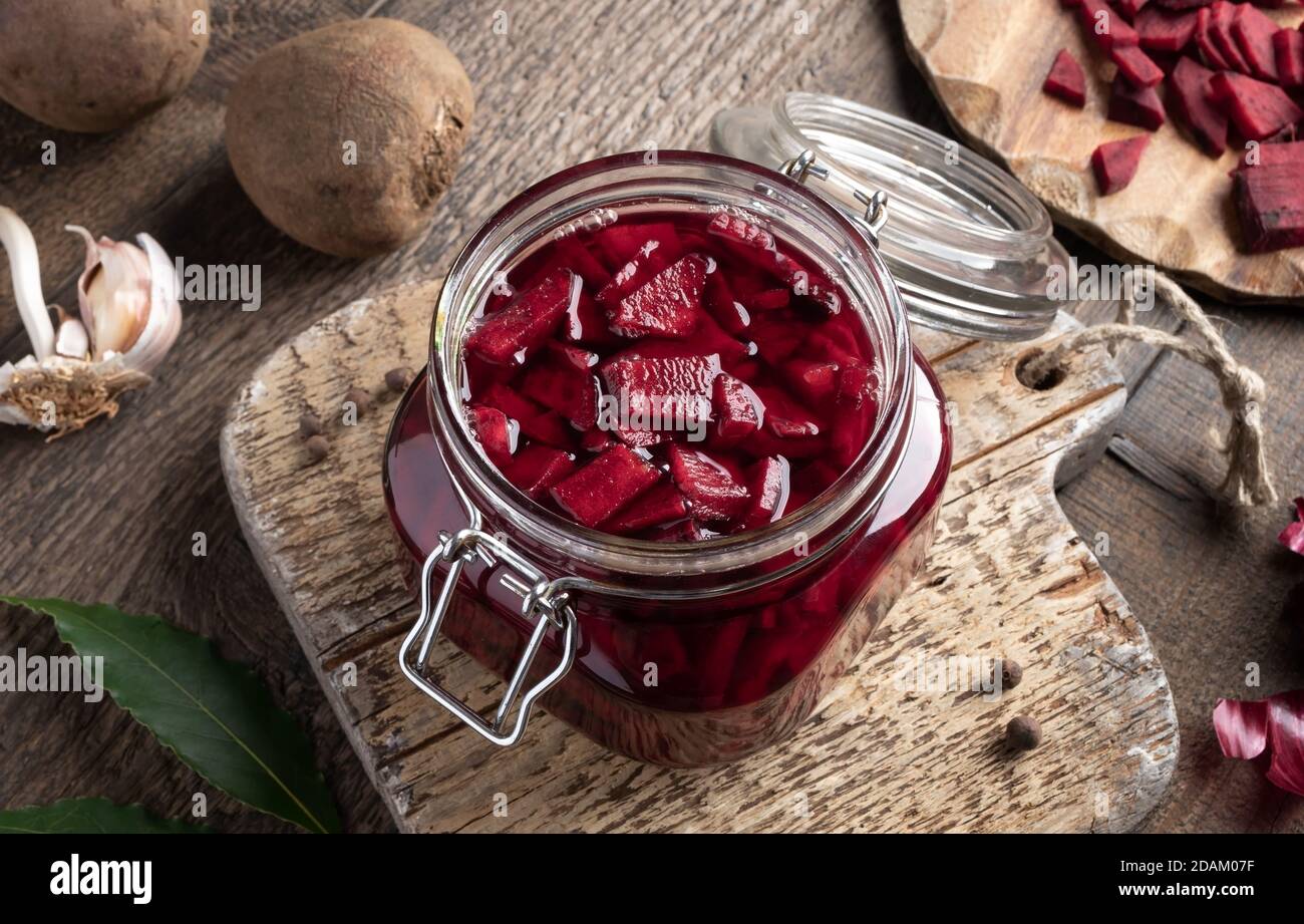 Fermented red beets in a jar, with garlic, bay leaf and spices Stock ...