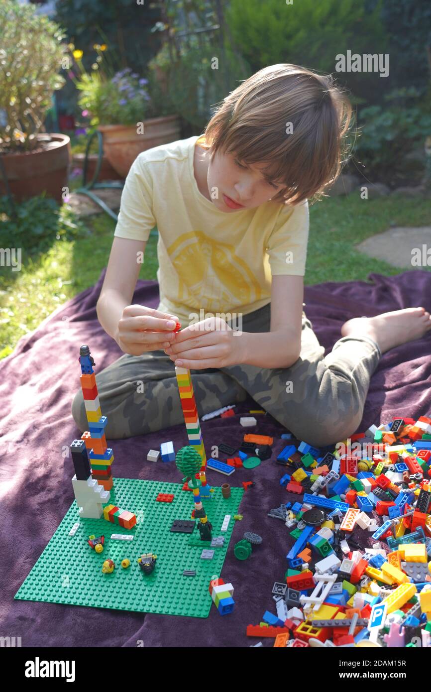 Child playing with lego outdoor Stock Photo - Alamy