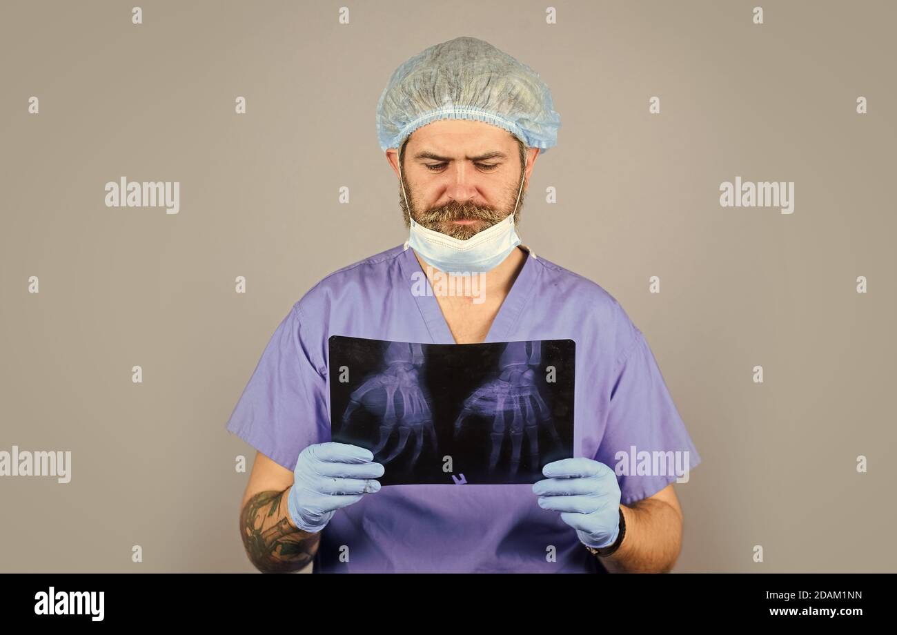 man look at roentgen. Radiologist hold xray. doctor examines ...