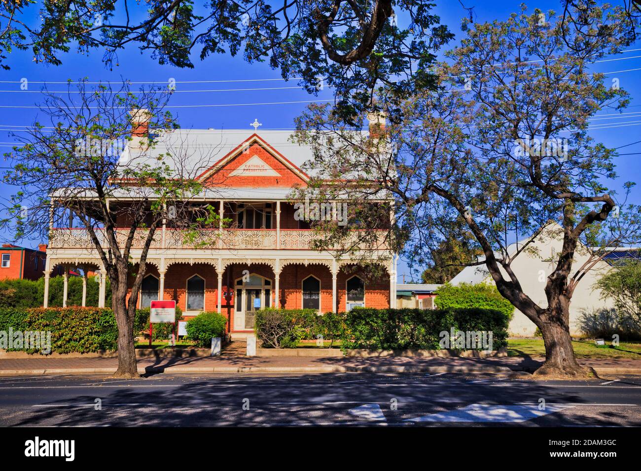 Facade of historic local catholic presbytery church and school in Dubbo ...