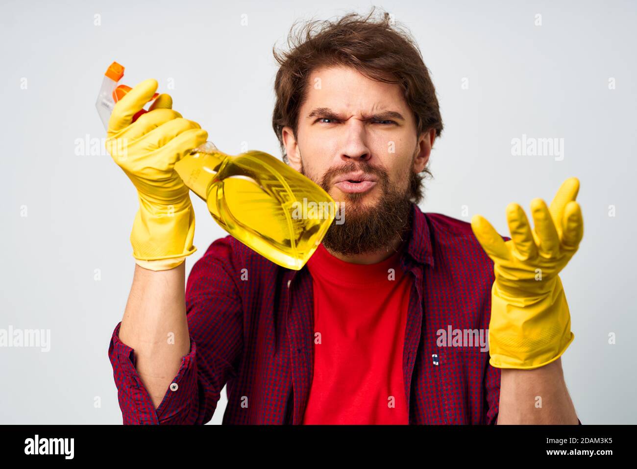 bearded man detergent rubber gloves rendering service cropped view ...