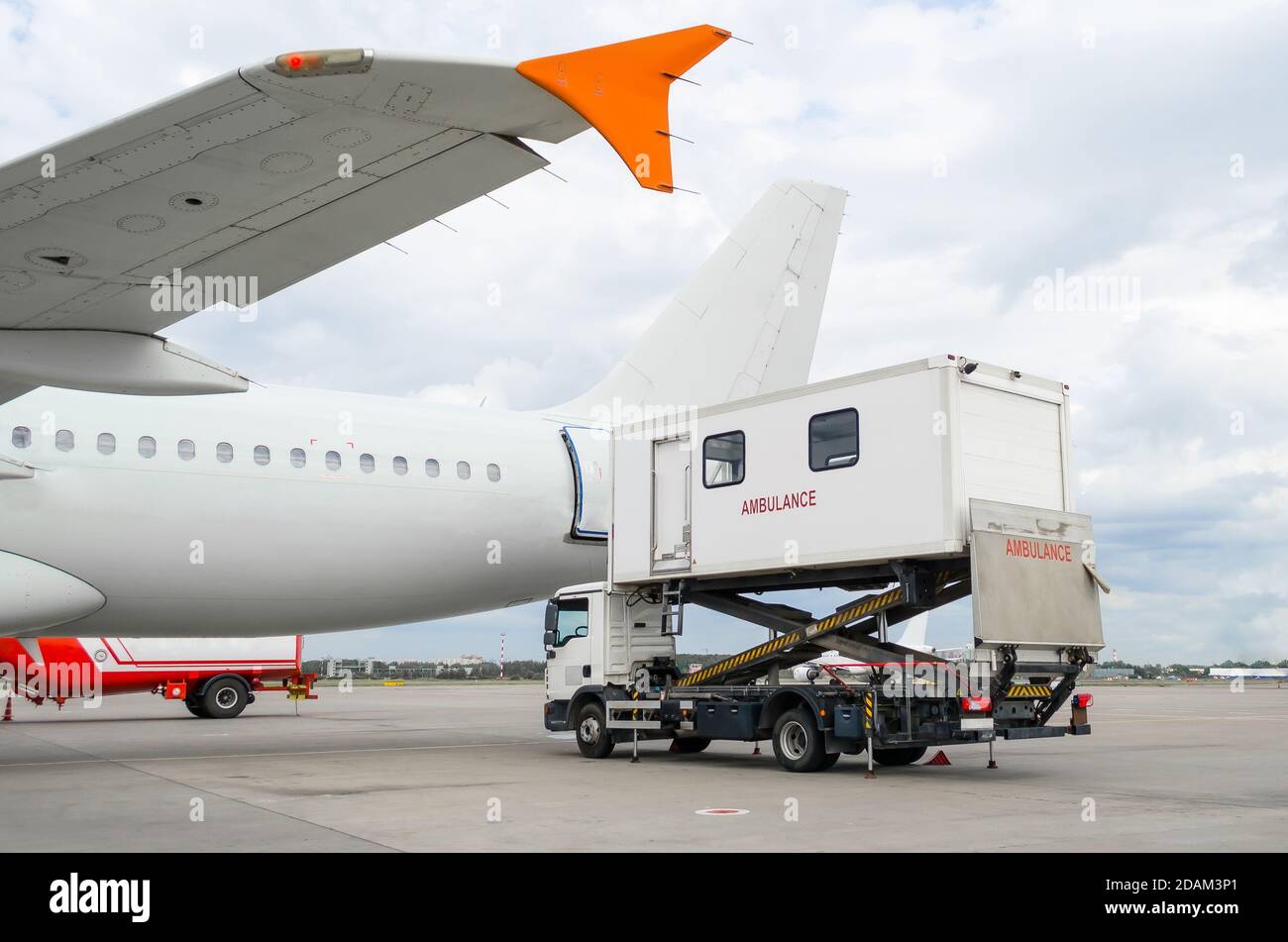Airplane at the airport with loading ladder for disabled people Stock ...