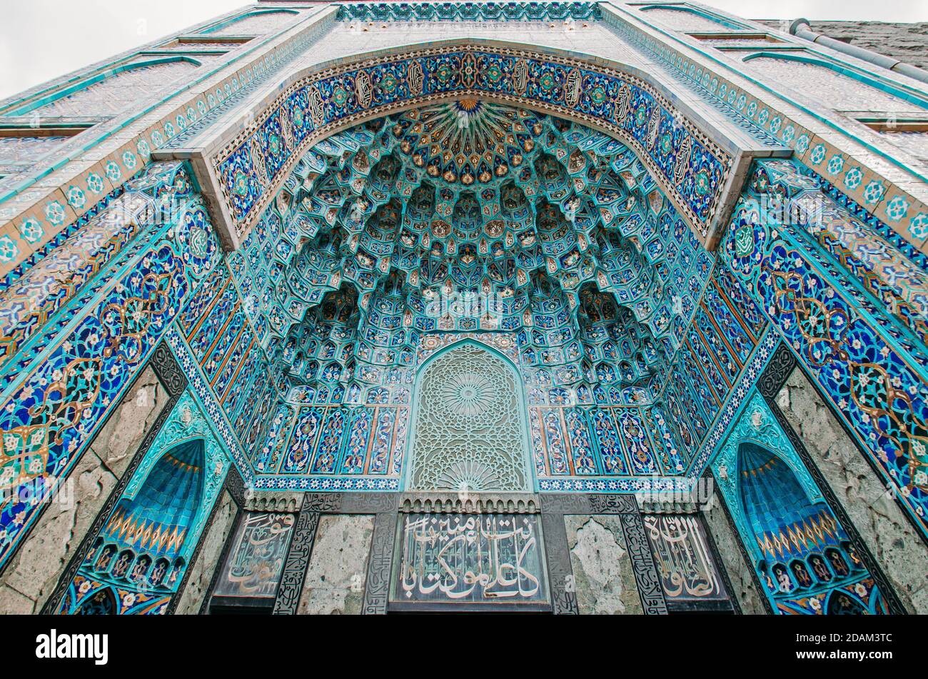 The arch of the mosque in blue tones is made from the mosaic of the ...
