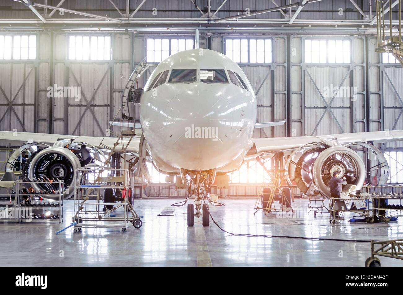 Passenger aircraft on maintenance of engine and fuselage repair in ...