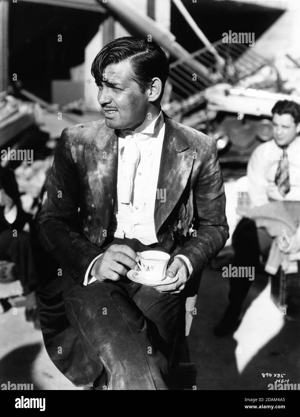 CLARK GABLE on set candid drinking cup of tea during filming of post ...