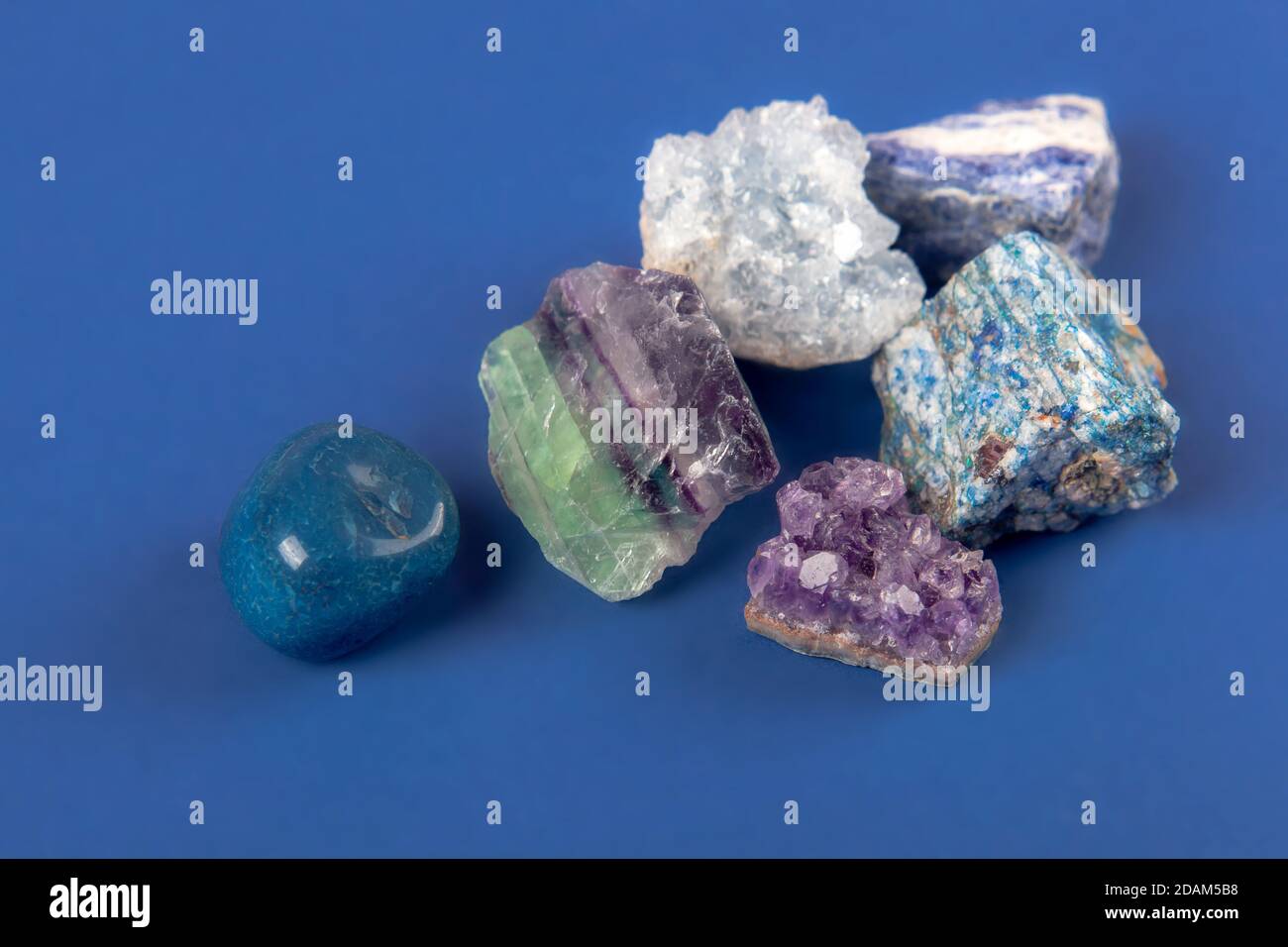 set of close up Natural minerals, precious stones on classic blue ...