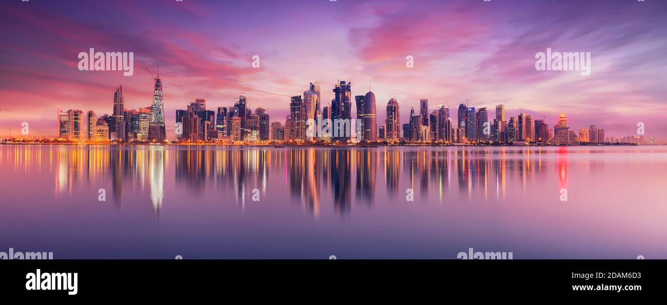 The skyline of Doha, Qatar during sunset Stock Photo - Alamy