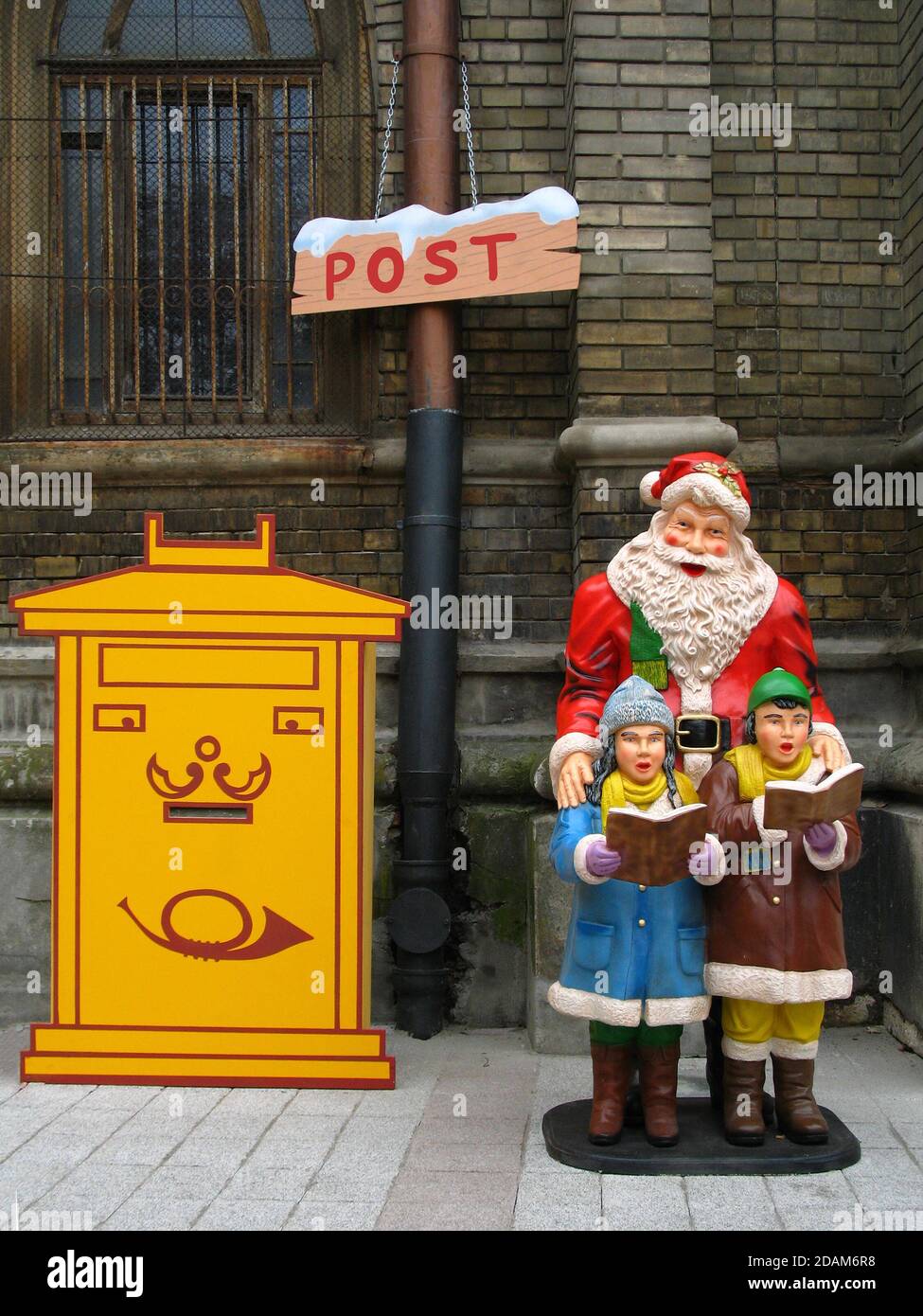 Statue of Santa Claus with children and a mailbox for Christmas letters ...